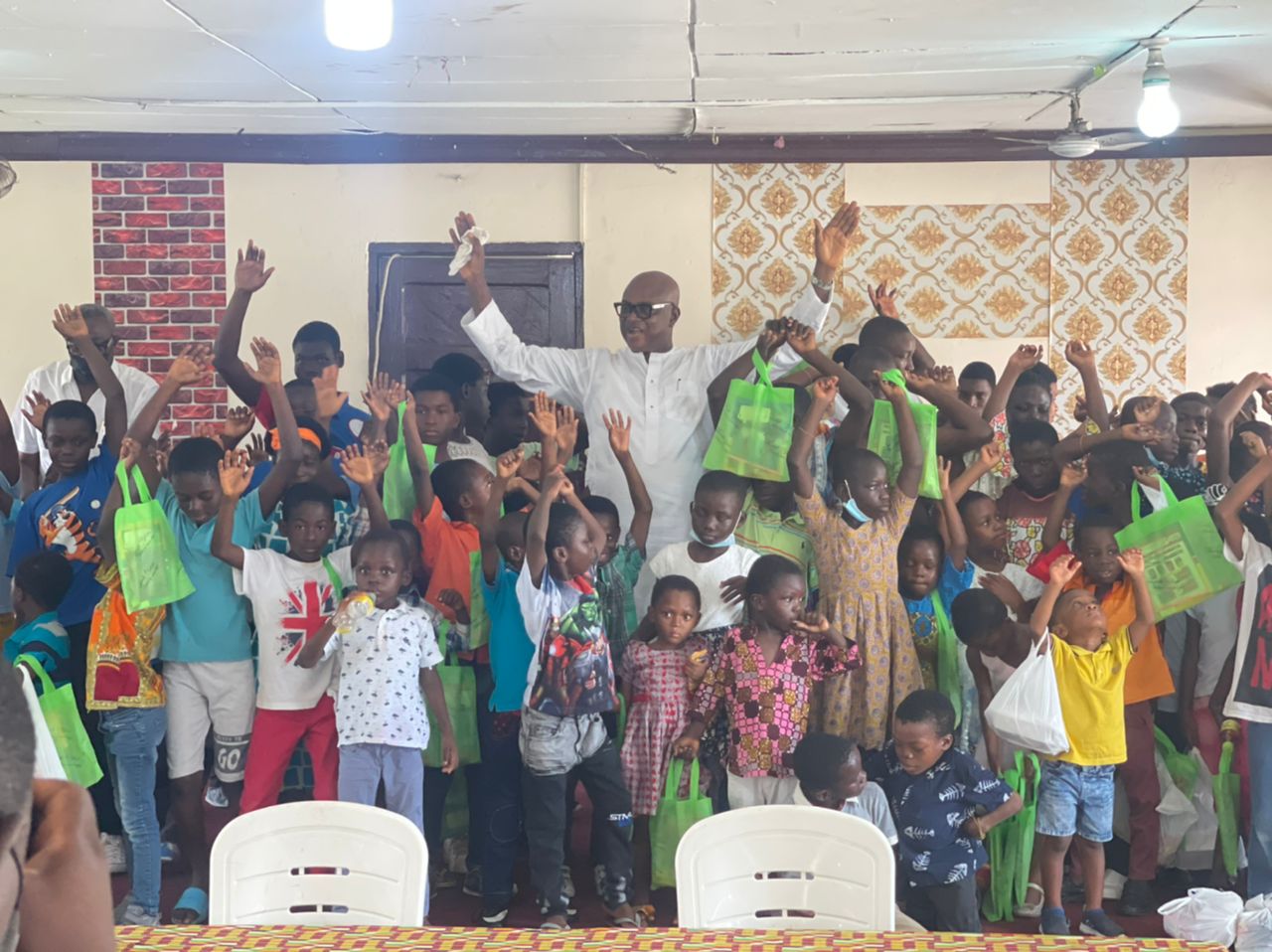 Kojo Bonsu feasts with children at the Osu Children's Home as part of ...