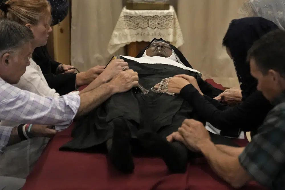 Nun whose body shows little decay since 2019 death draws hundreds to ...