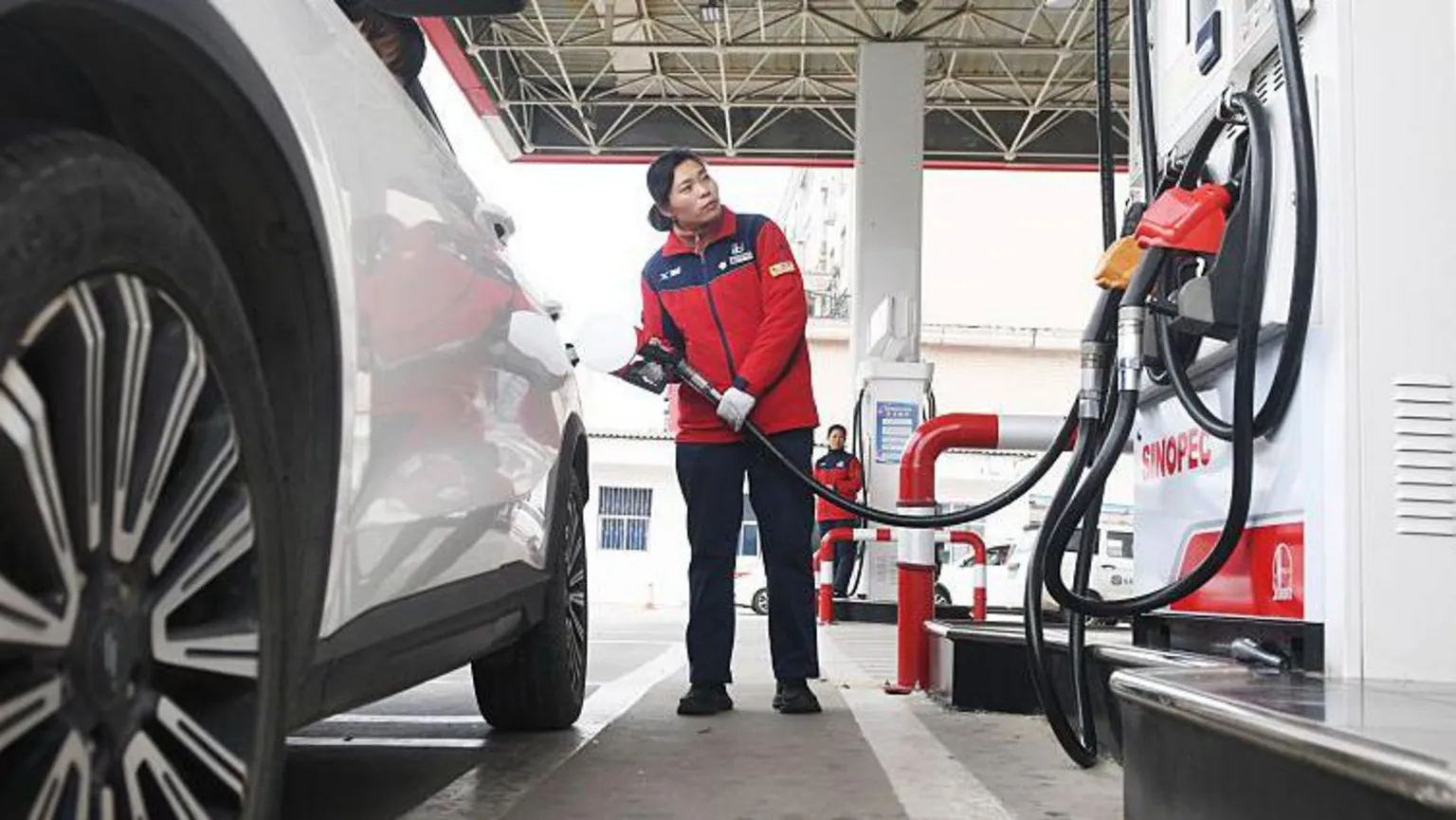 China dials back on fuel price hikes to 'reduce burden' on drivers ...